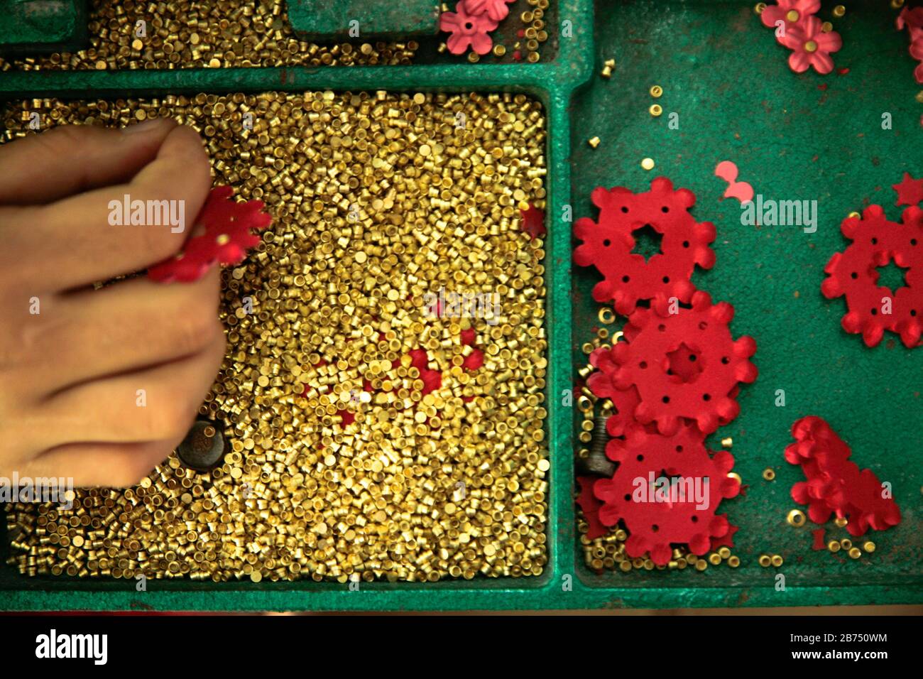 Workers make Remembrance red poppy flower at Good Luck Factory in ...