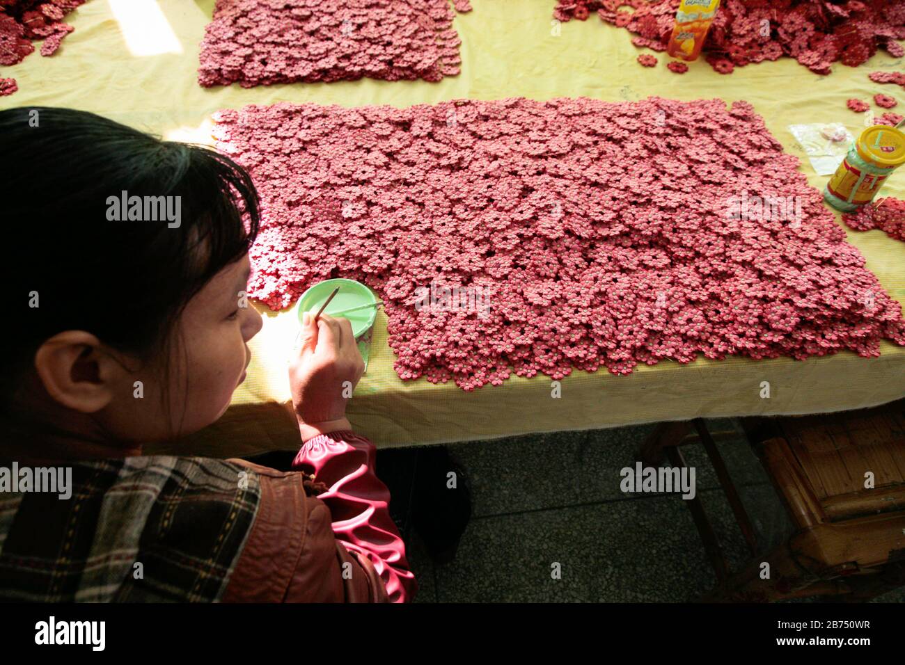 Workers make Remembrance red poppy flower at Good Luck Factory in ...