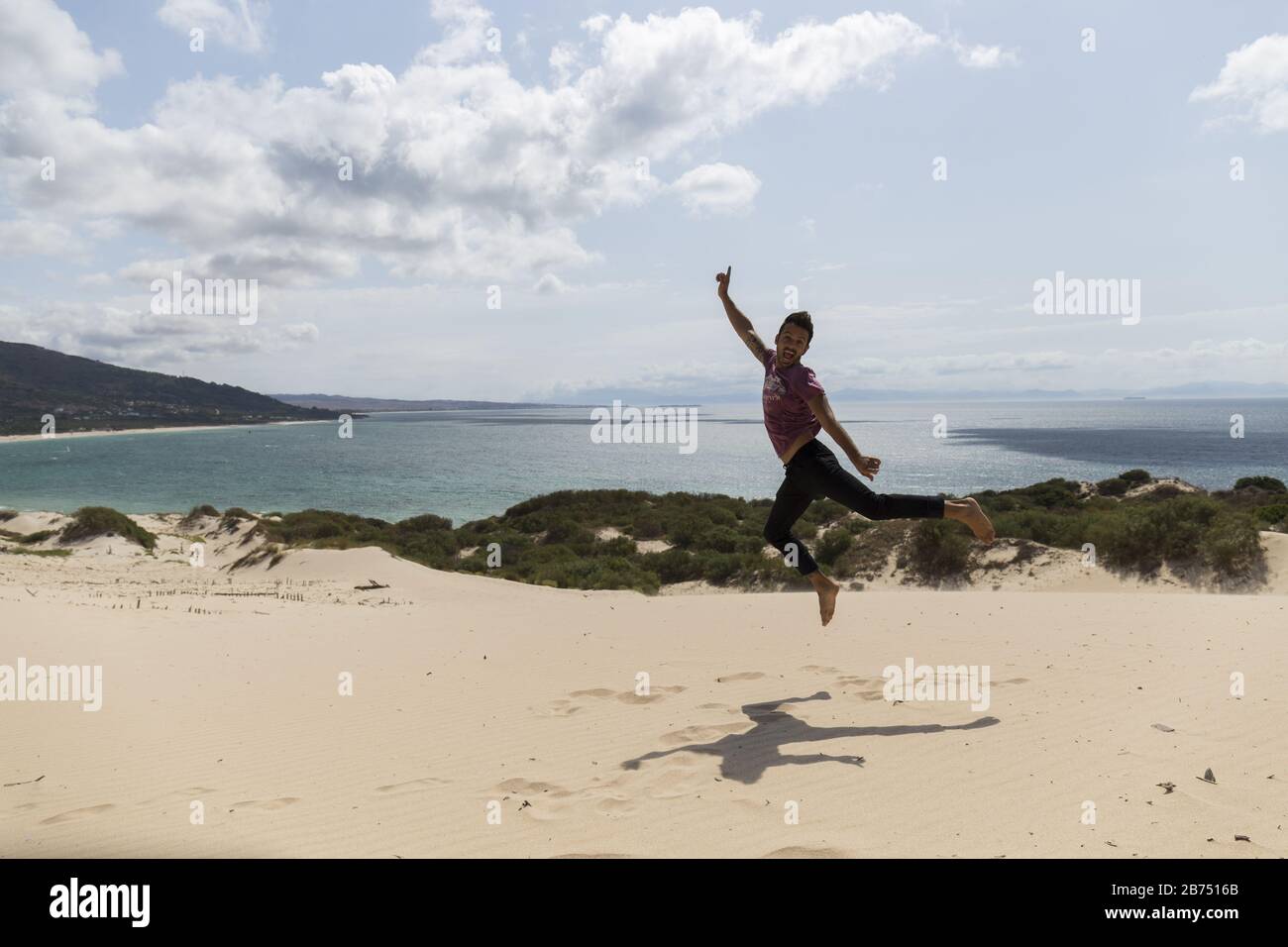 man jumping on the beach Stock Photo - Alamy