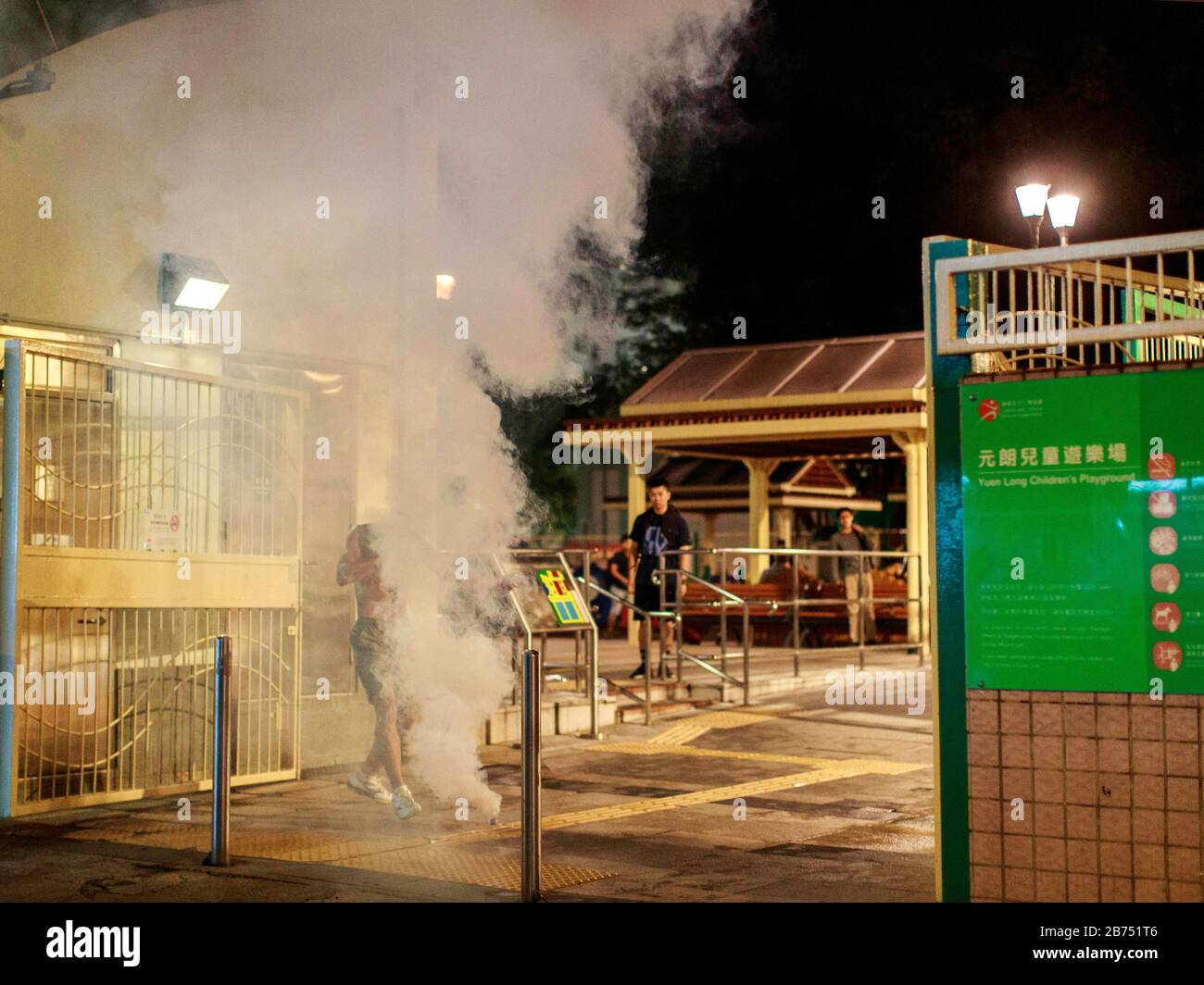 Man kicks tear gas canister hi-res stock photography and images - Alamy