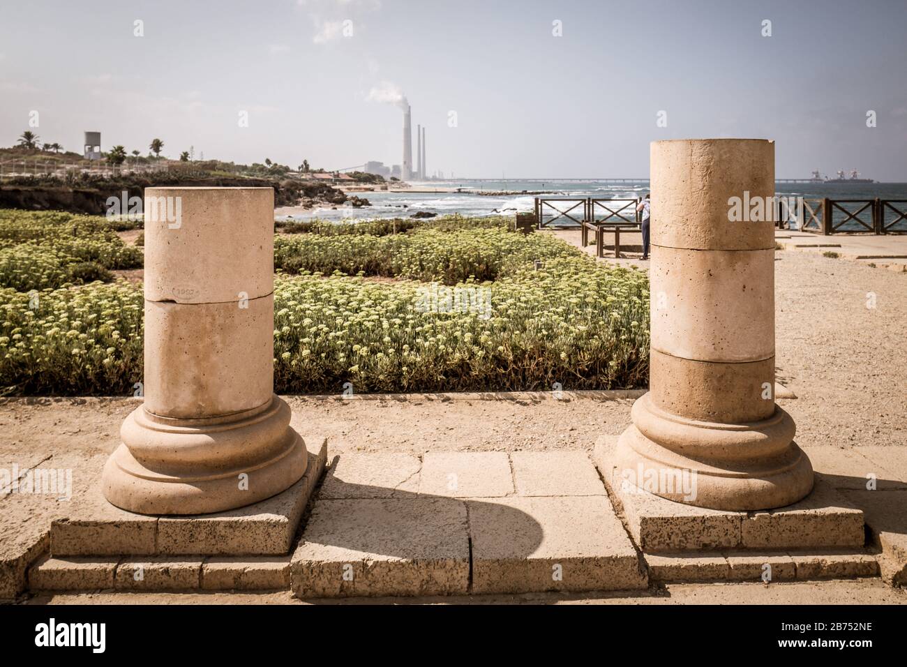 Ruins of the ancient port of Caesarea, behind it the coal-fired power ...