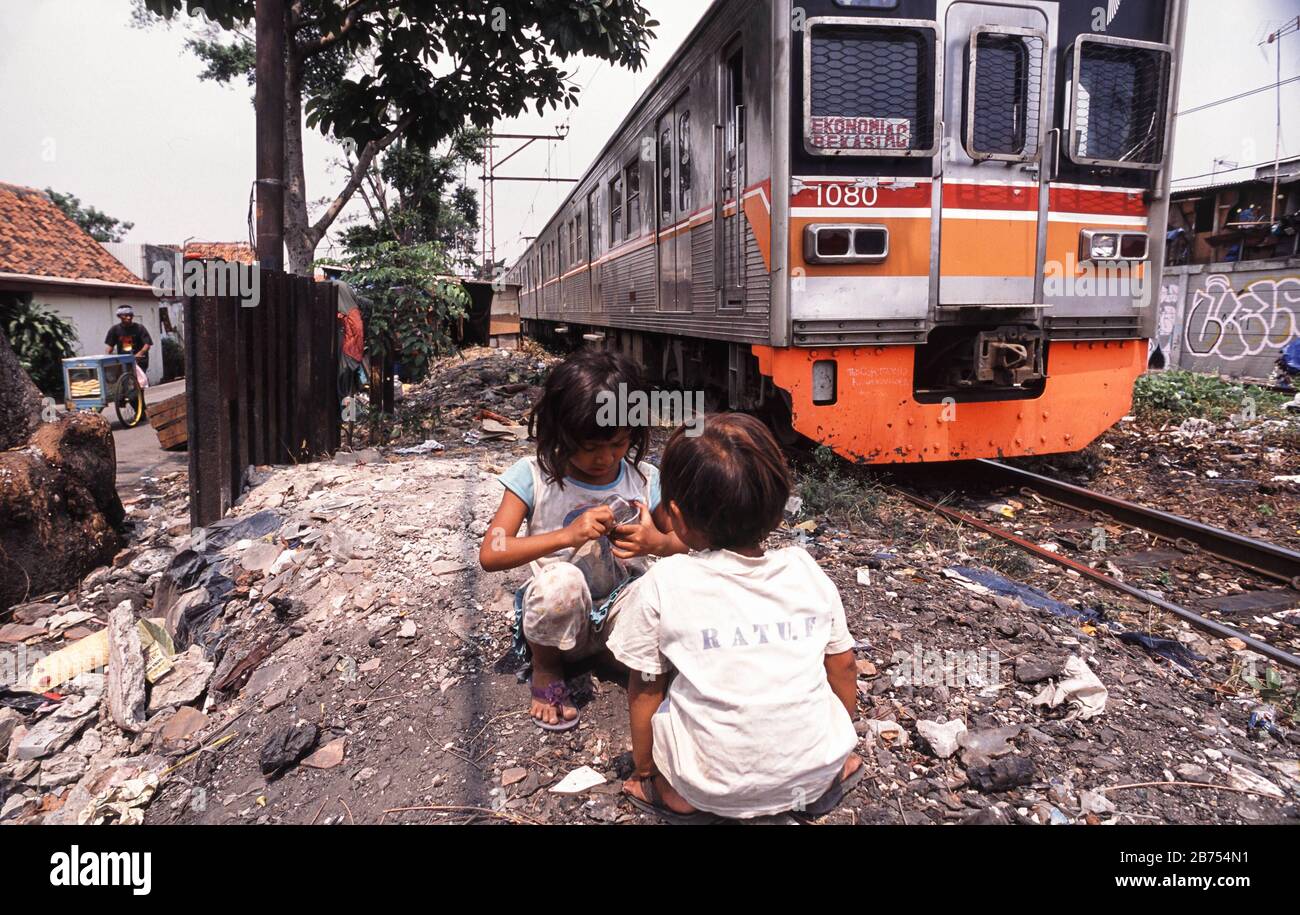08.08.2009, Jakarta, Java, Indonesia, Asia - Two little girls sit next ...