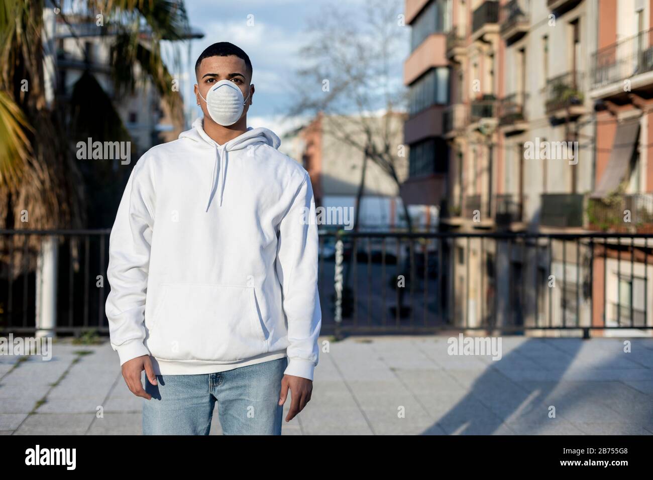 Sick man wearing protective facial mask against transmissible ...