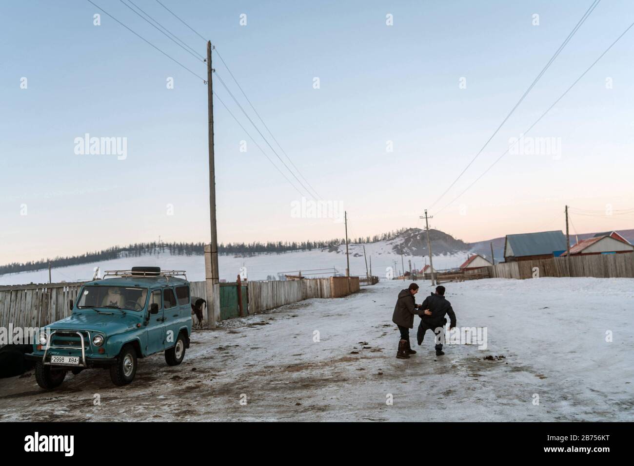 Two drunk men on their way home. Alcoholism is a widespread problem in ...