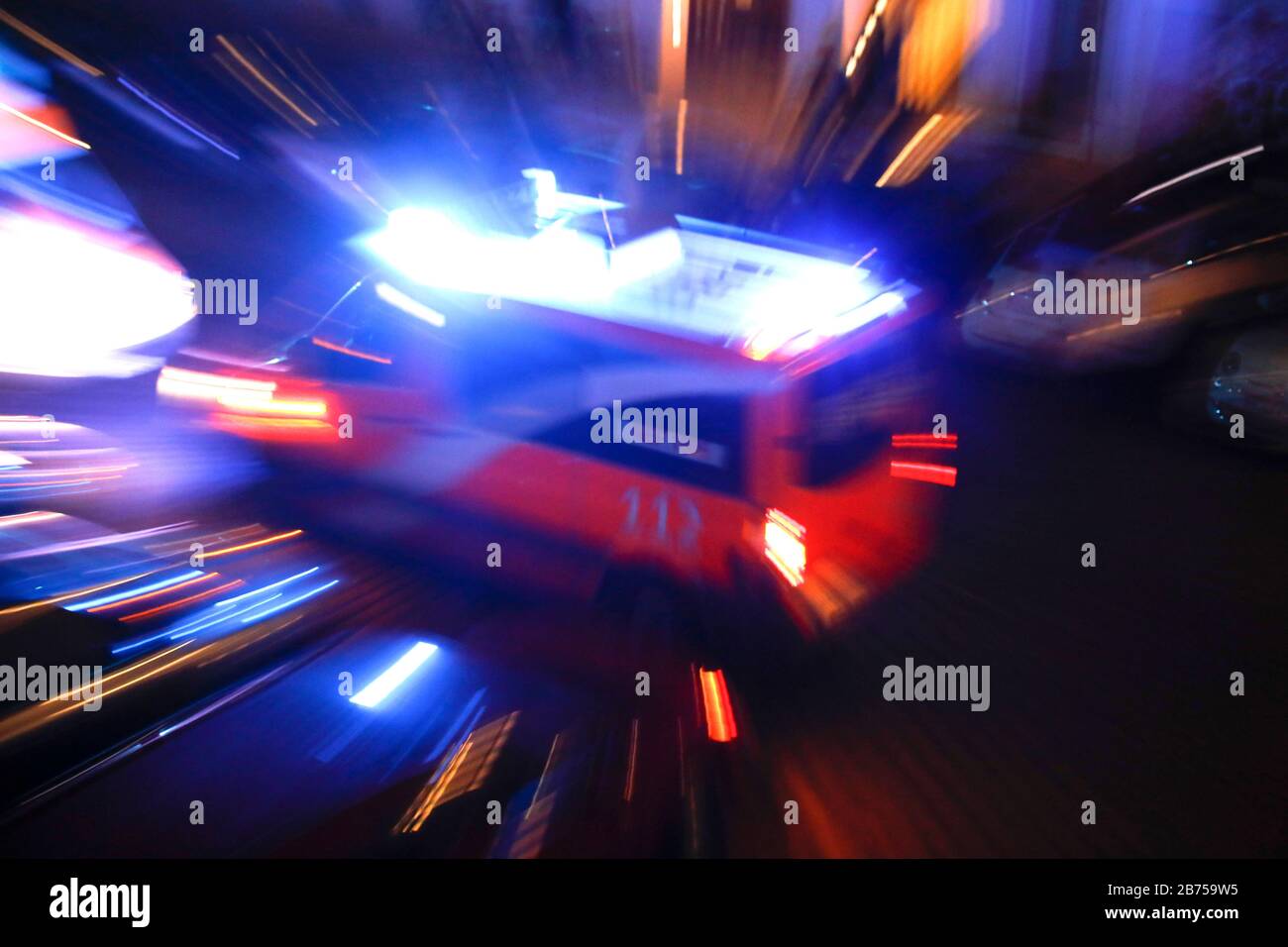 With the blue light switched on, an emergency ambulance of the Berlin ...