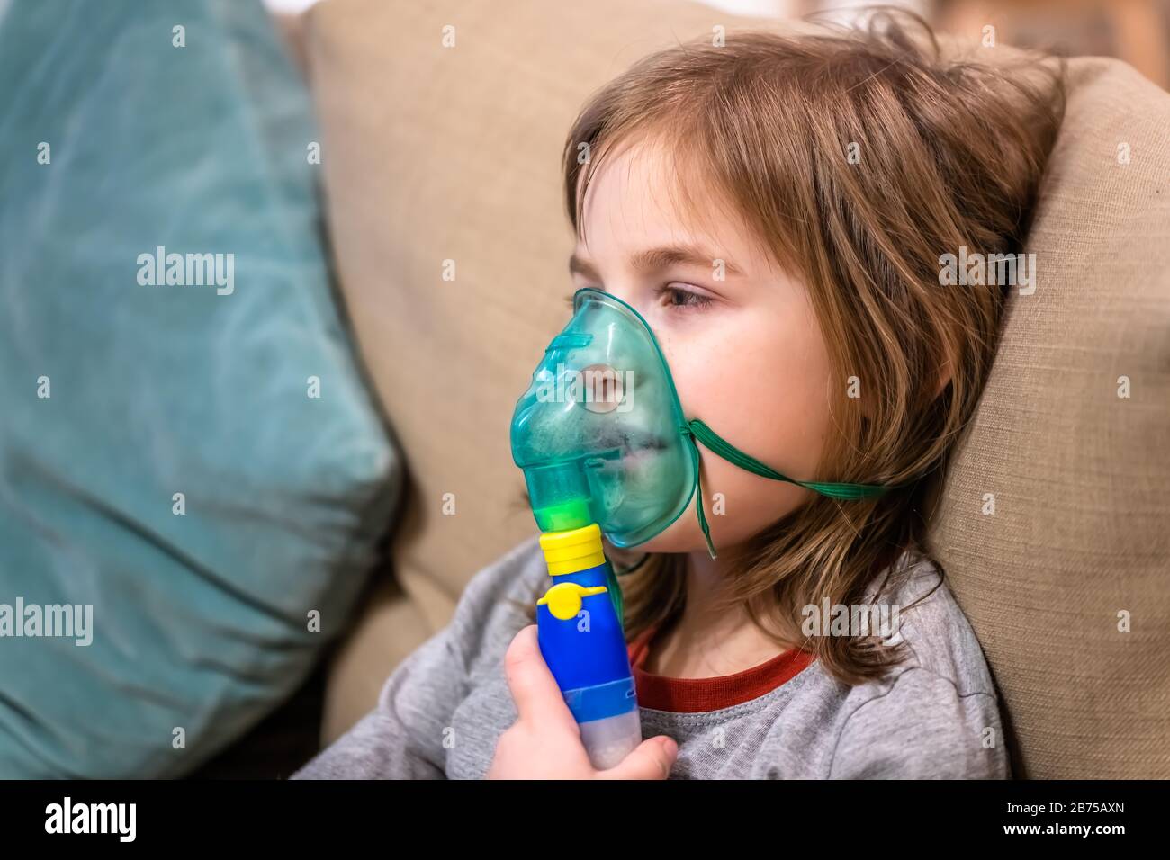 Cute baby girl breathes through nebulizer inhaler Stock Photo - Alamy