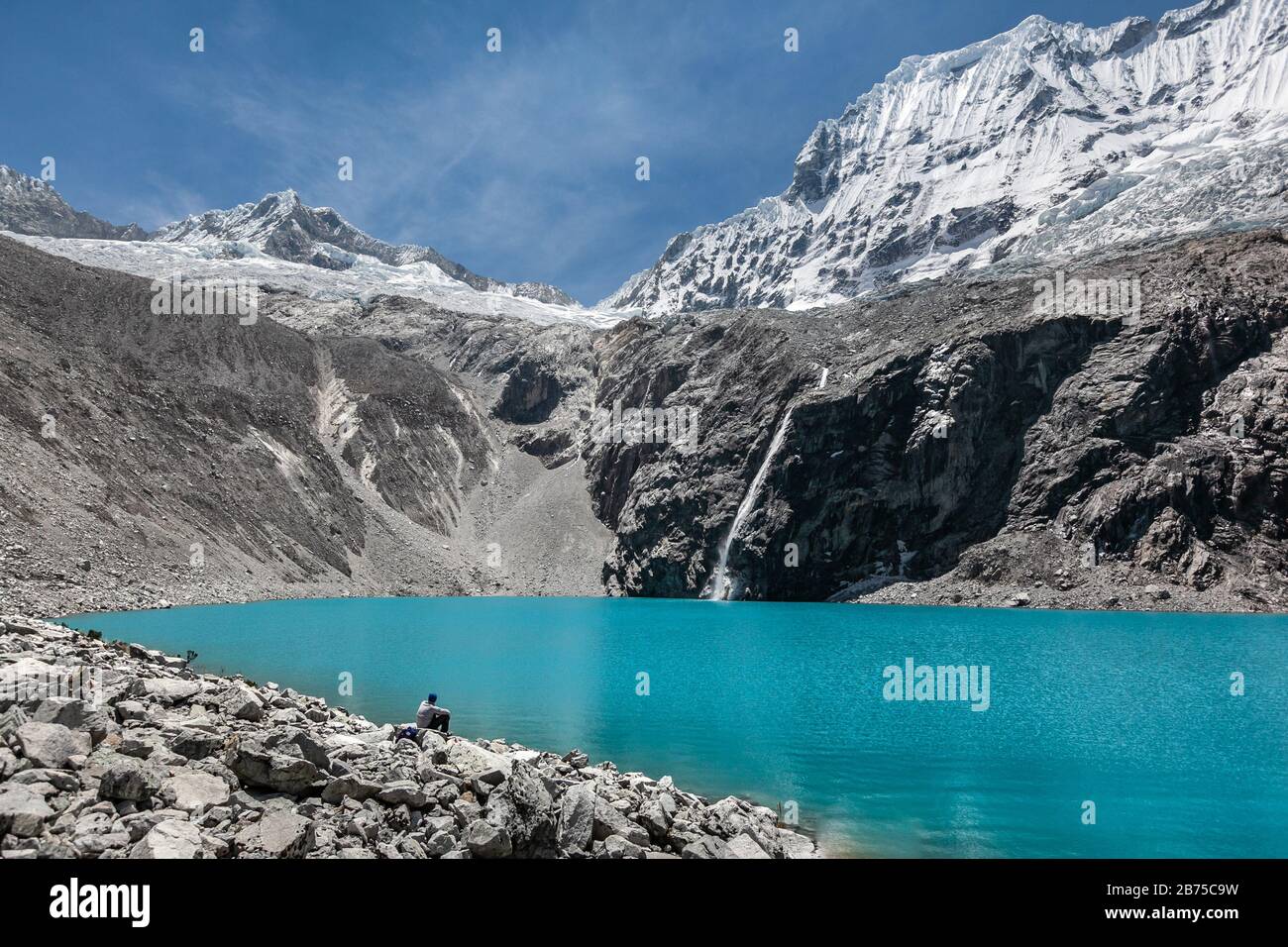 hiking to lagoon 69 turquoise water snowcapped Peruvian andes ...