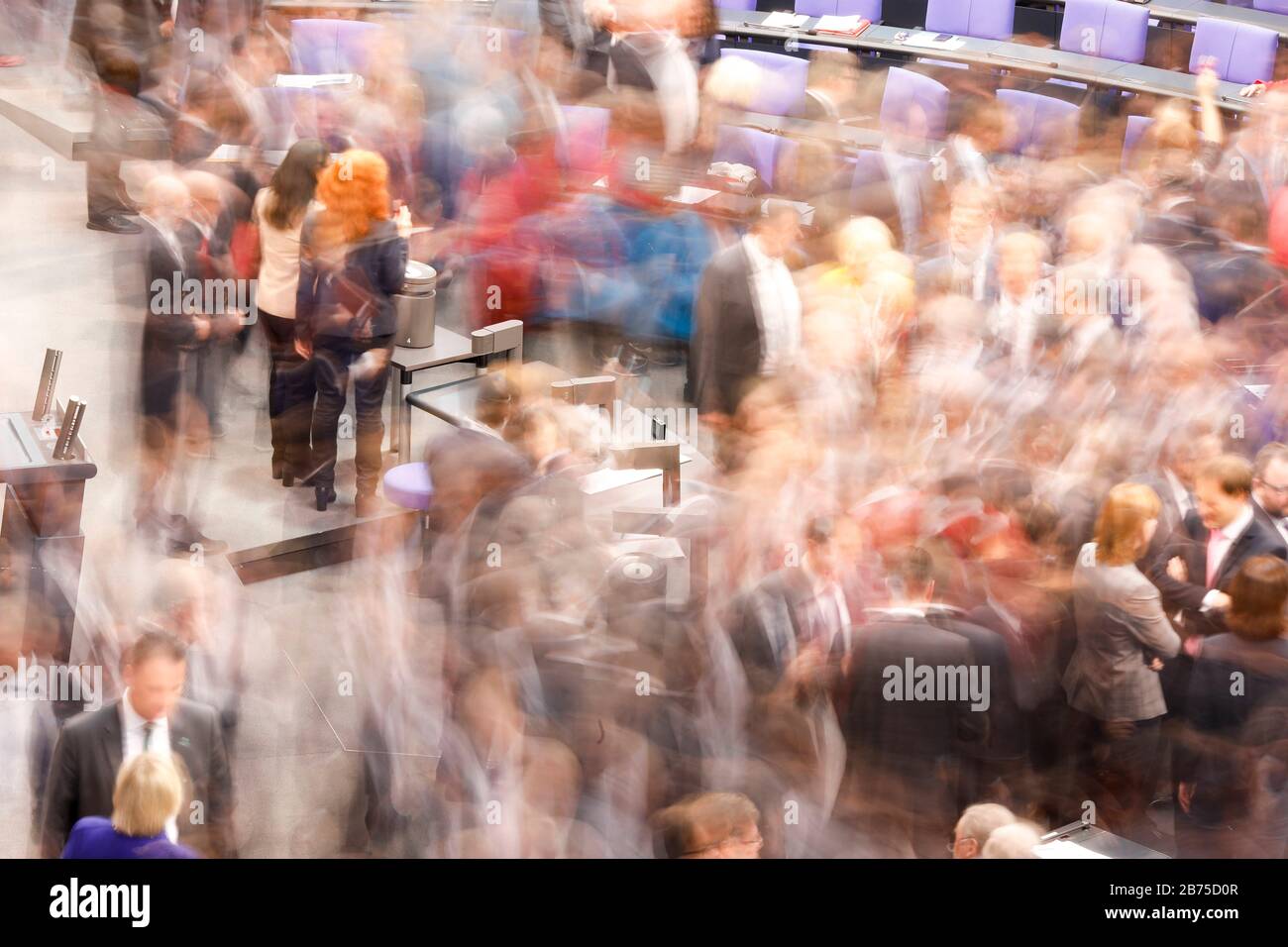 Blurred and blurred by a long exposure, members of the German Bundestag ...