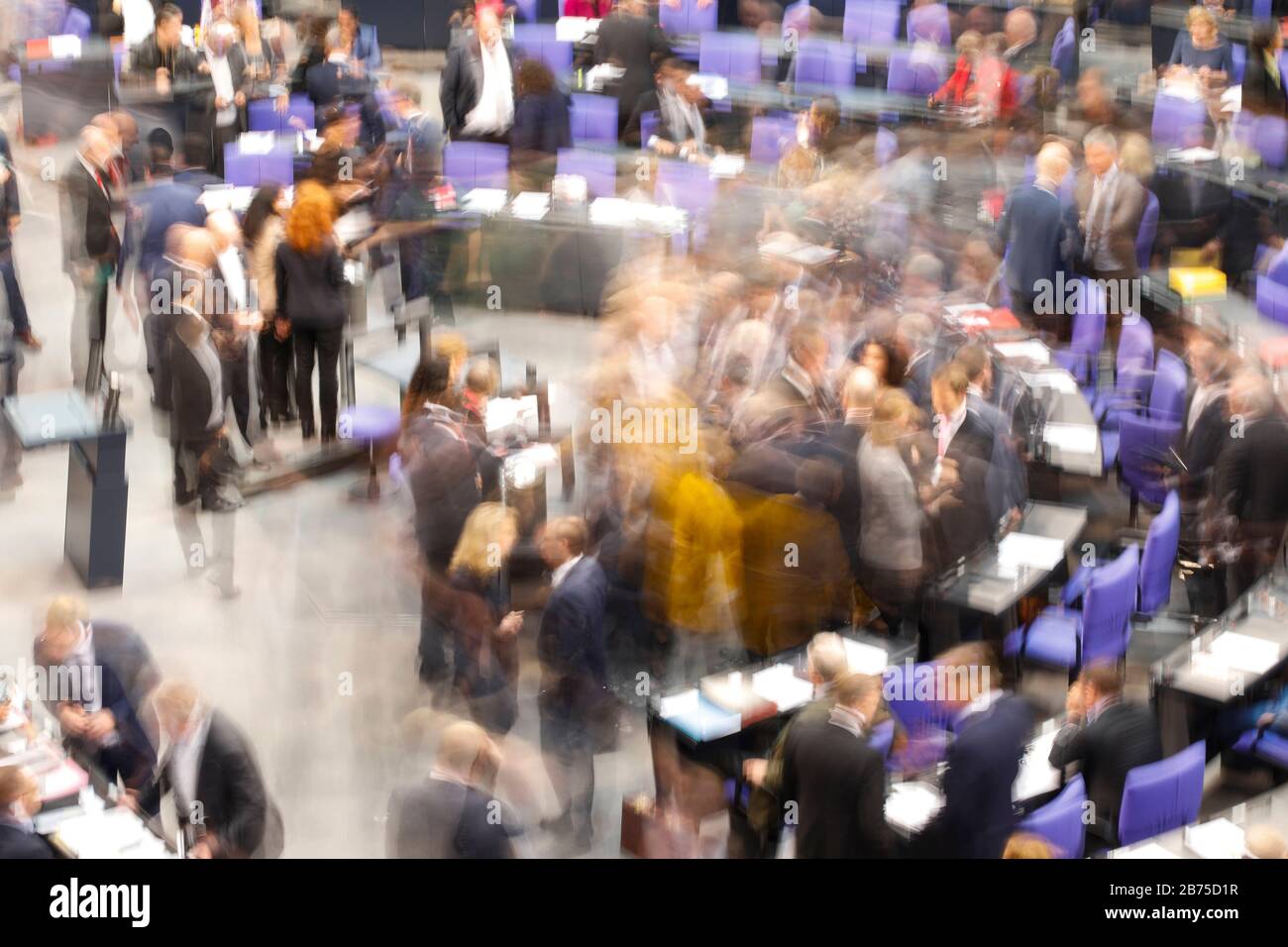 Blurred and blurred by a long exposure, members of the German Bundestag ...