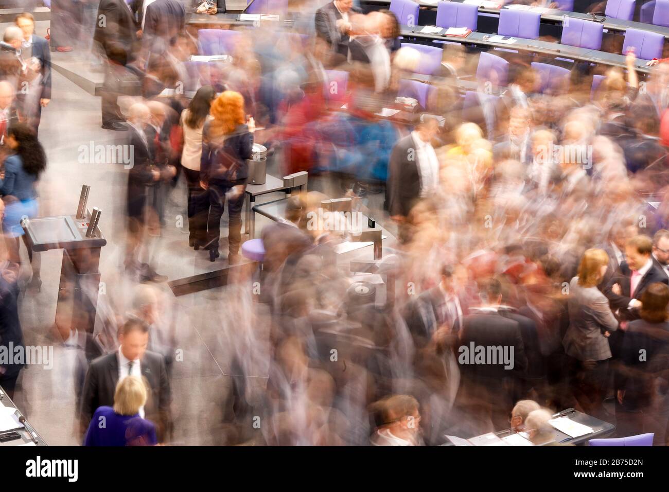 Blurred and blurred by a long exposure, members of the German Bundestag ...
