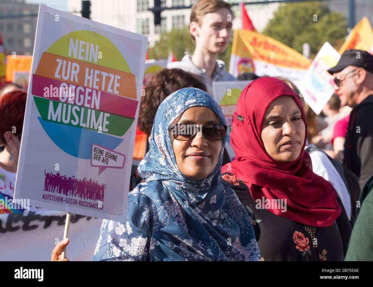 Muslim women demonstrate with signs saying "No to incitement against ...