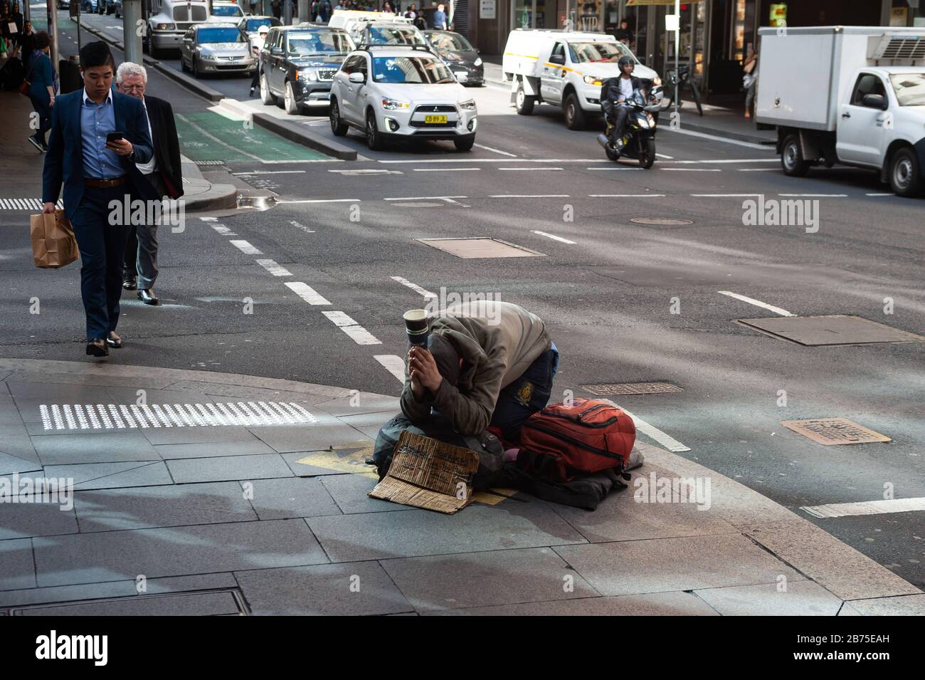 Man on knees begging in hi-res stock photography and images - Alamy