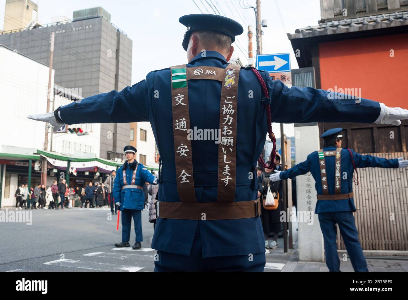 23.12.2017, Kyoto, Japan, Asia - Traffic controllers regulate traffic ...