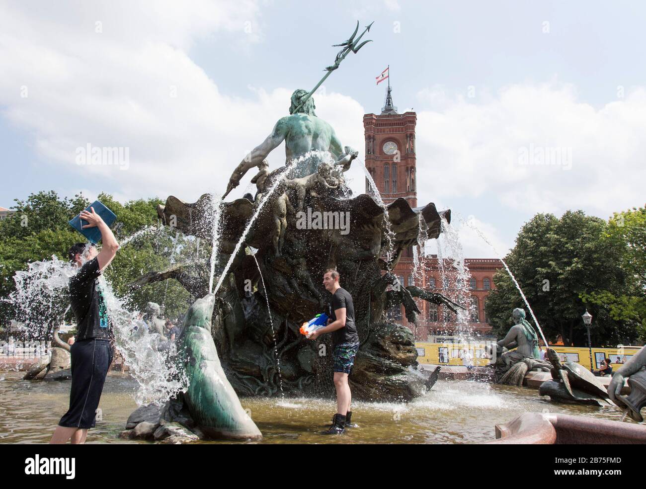 Water hungry participants of this year's water battle at Berlin's ...