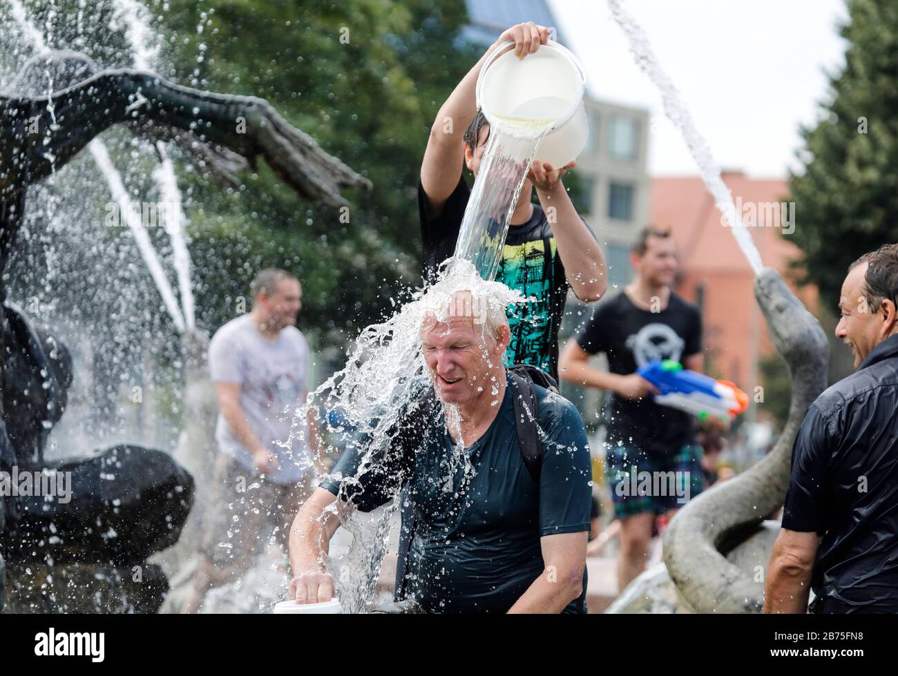Water hungry participants of this year's water battle at Berlin's ...