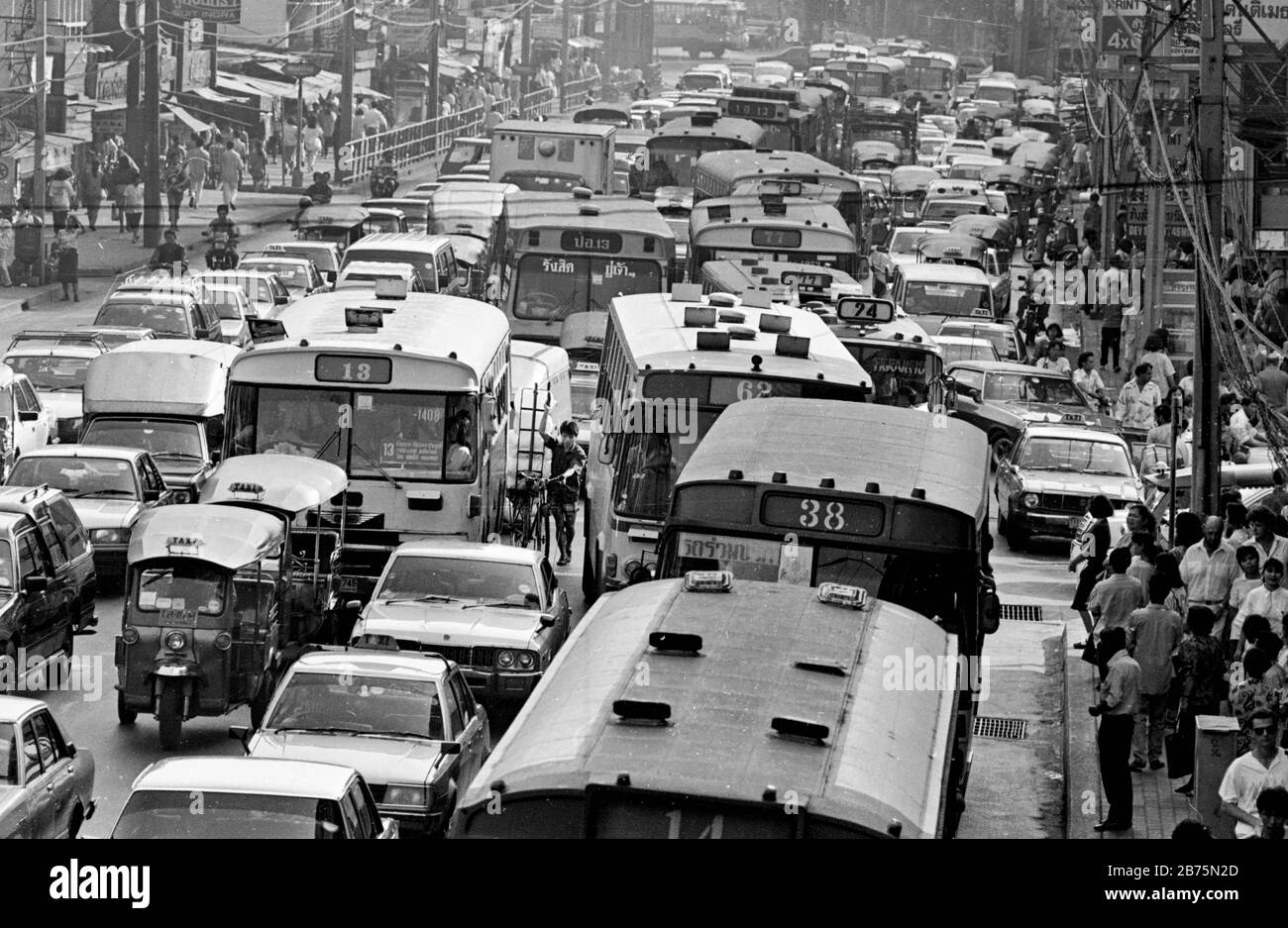 Traffic jam in Bangkok, Thailand, 15.12.1989. A woman sitting on the ...