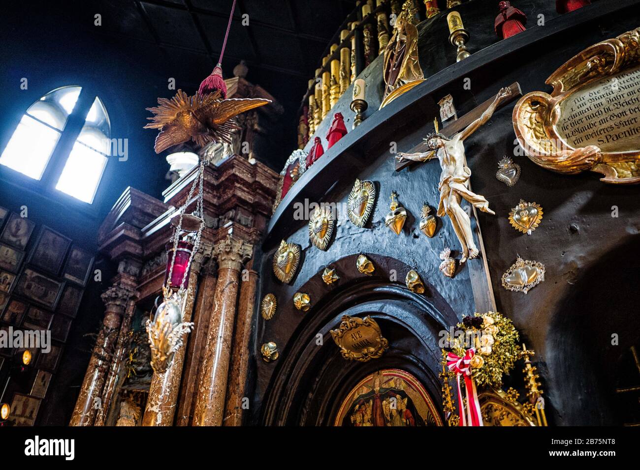 A crucifix and many hearts entwined with thorns decorate the rood ...