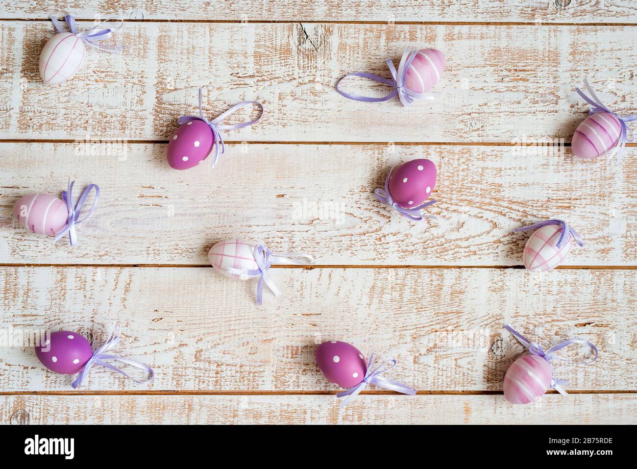 Easter eggs over white wooden vintage table - top view, copy space ...