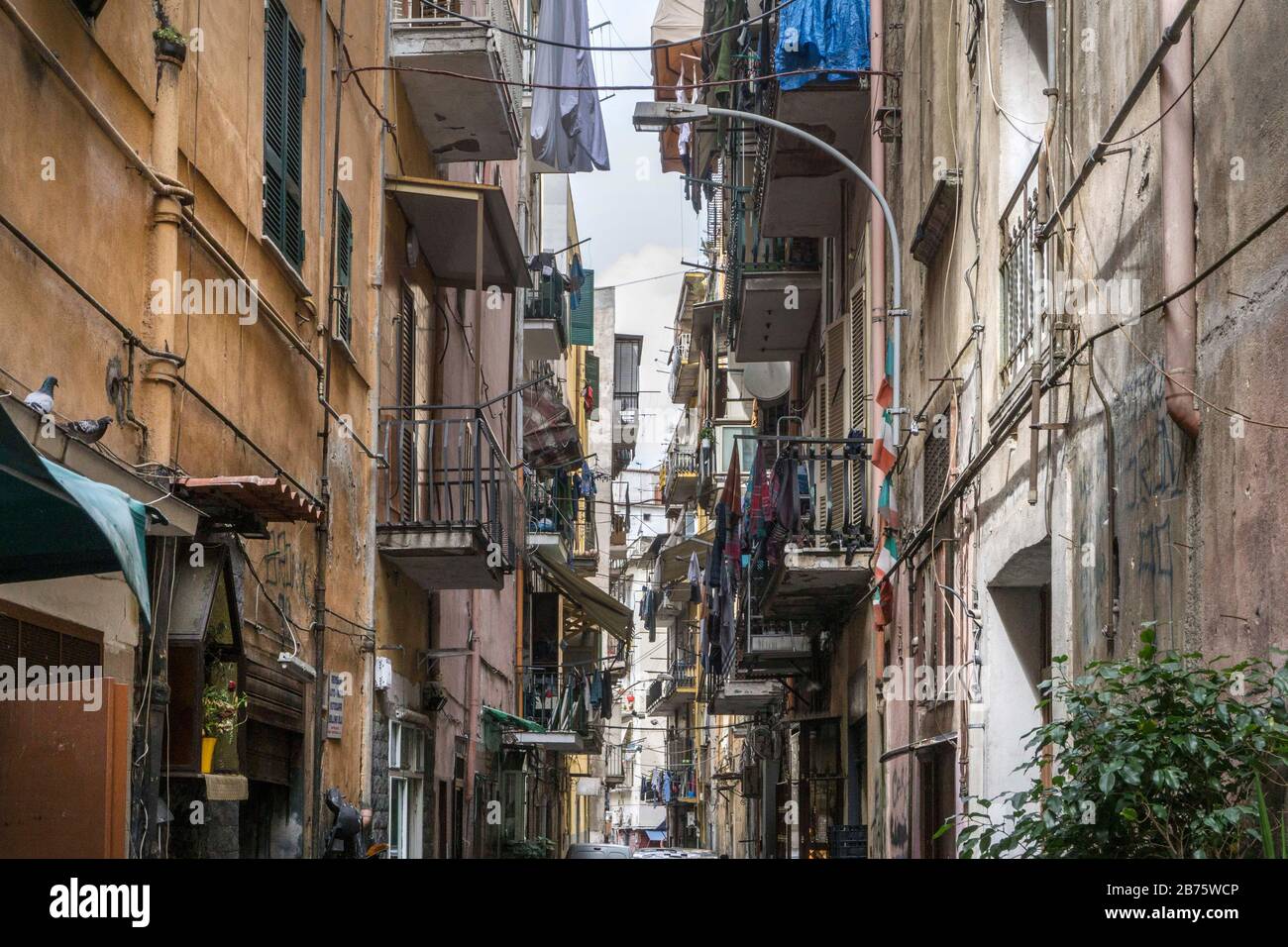 View into a street with balconies and hanging laundry in the old town ...
