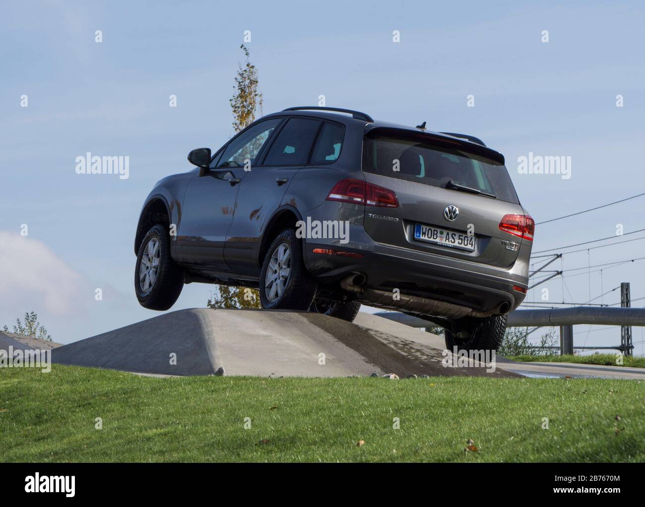 A Volkswagen Touareg will drive over a test area in the Autostadt on ...