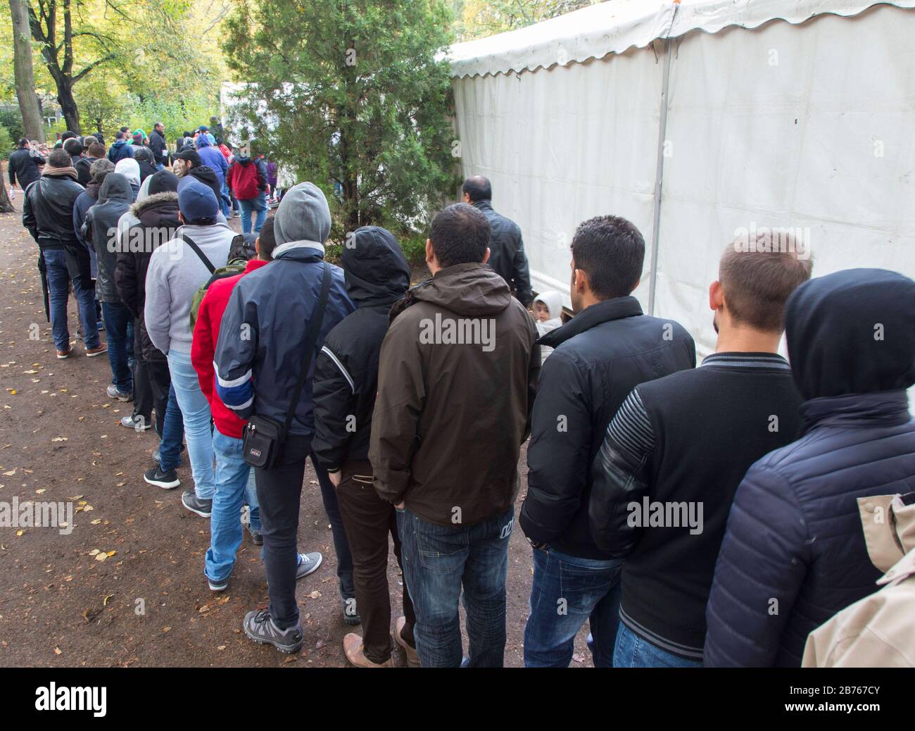 Refugees seeking asylum are waiting at the Berlin State Office for ...