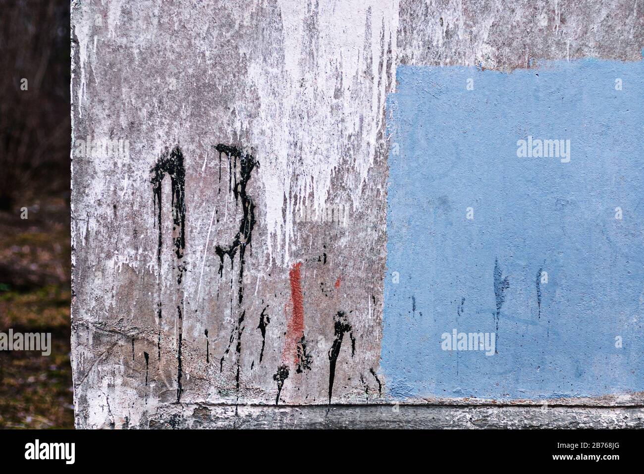 number 13 painted on dirty concrete wall on the corner of old abandoned ...