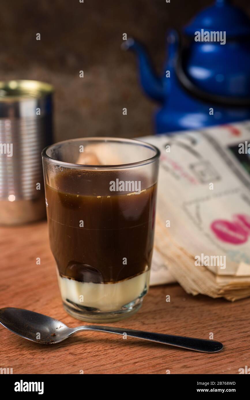 Daily habit of morning coffee with newspaper Stock Photo - Alamy