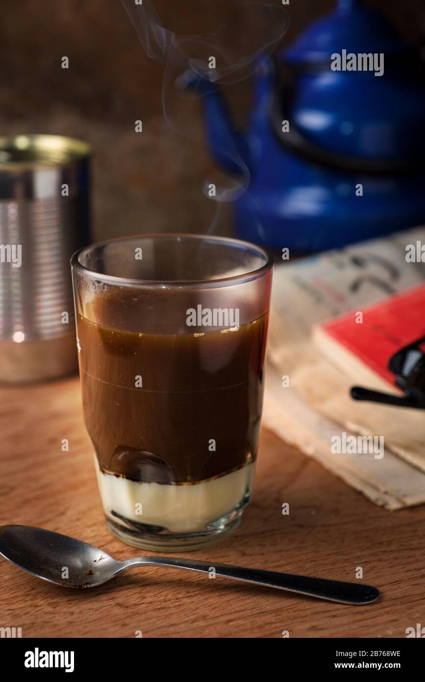 Daily habit of morning coffee with newspaper Stock Photo - Alamy