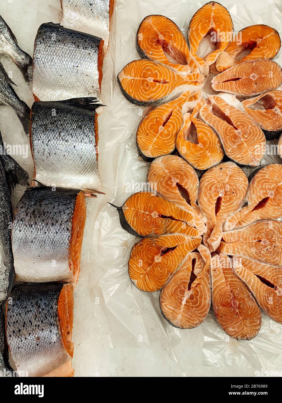 fresh raw red fish lies on the ice as a background for food Stock Photo ...