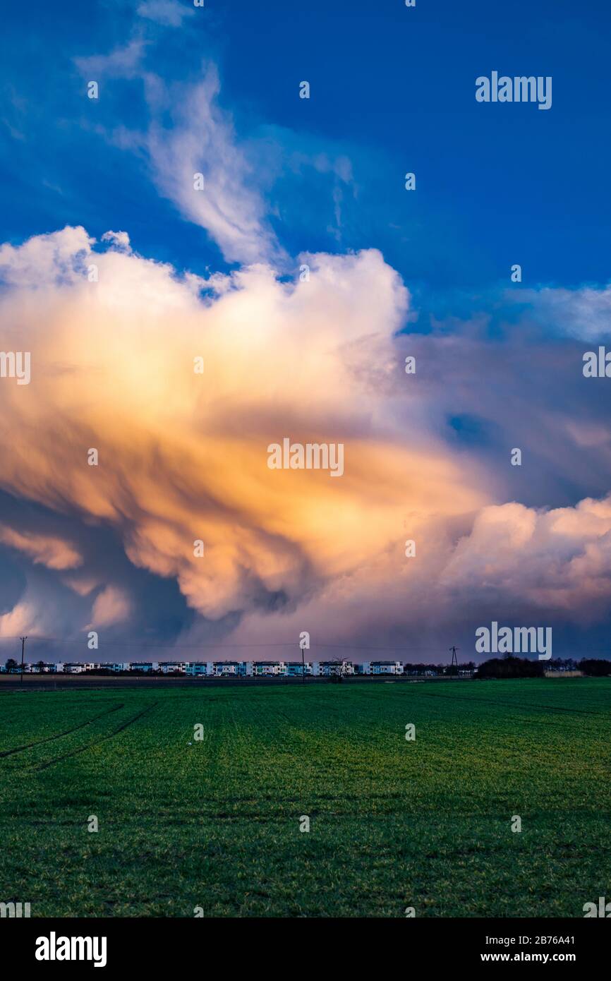 Dramatic colorful sky, before storm and during sunset. Huge clouds ...