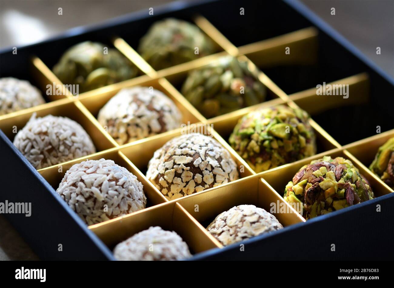 Close up of traditional Iraqi pastries, dates covered with pumpkin ...