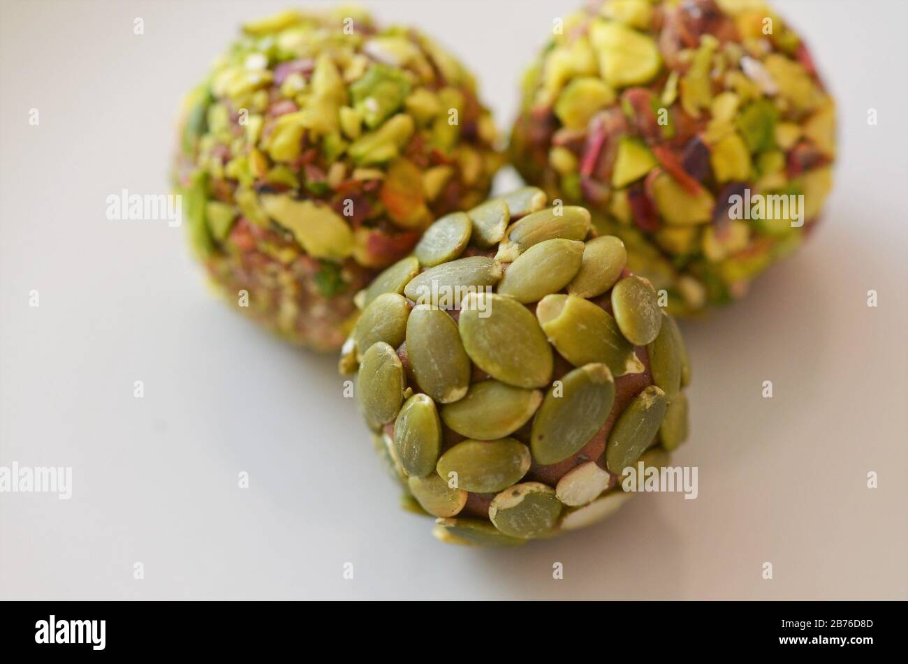 Close up of traditional Iraqi pastries, dates covered with pumpkin ...