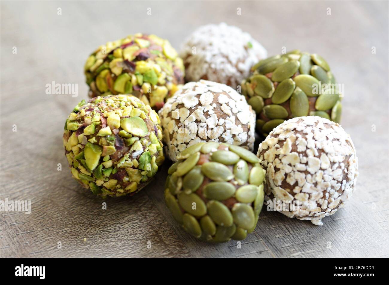 Close up of traditional Iraqi pastries, dates covered with pumpkin ...