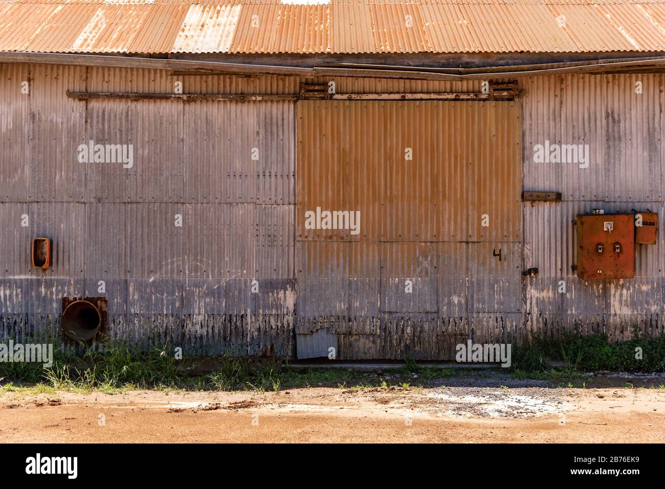 Metallic barn or deposit sliding door on silver color with an old ...