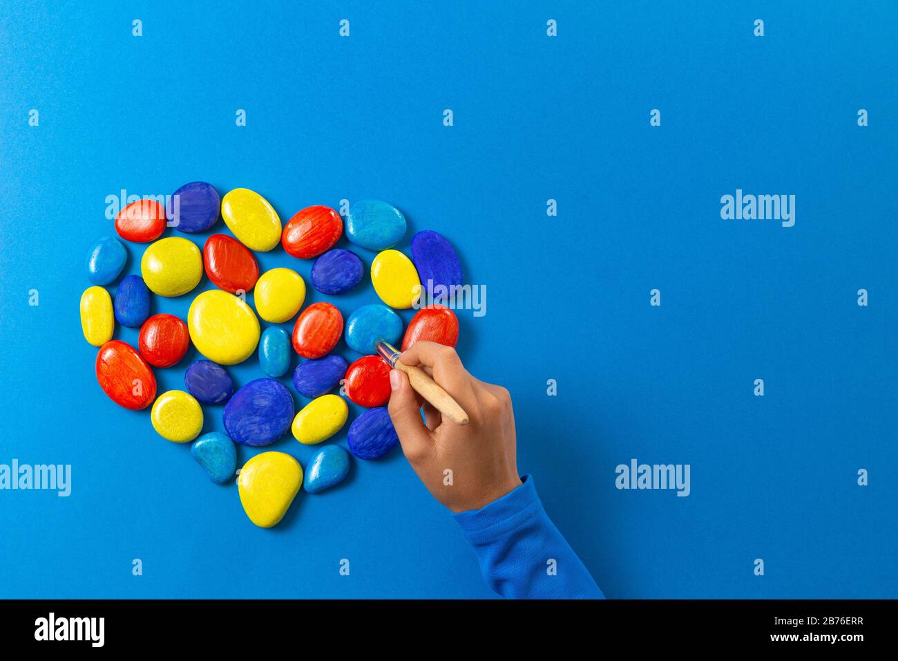Child Painting Stones High Resolution Stock Photography and Images - Alamy