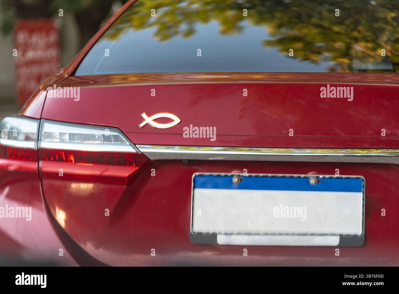 Back of a red wine car with the Jesus logo with a blank car plate Stock ...
