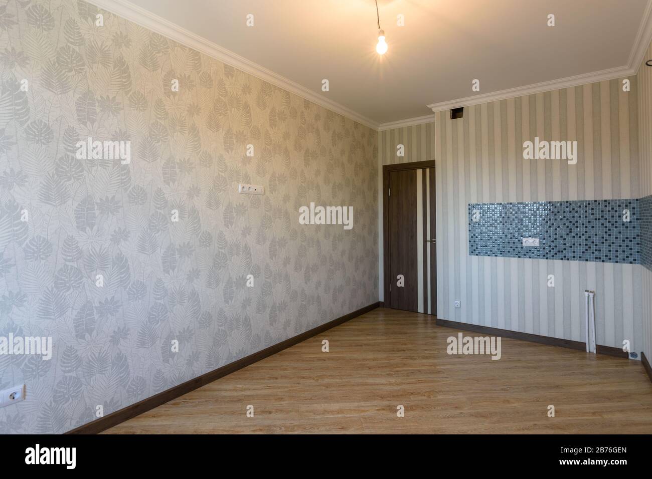 Interior of renovated living room without furniture, place for kitchen ...