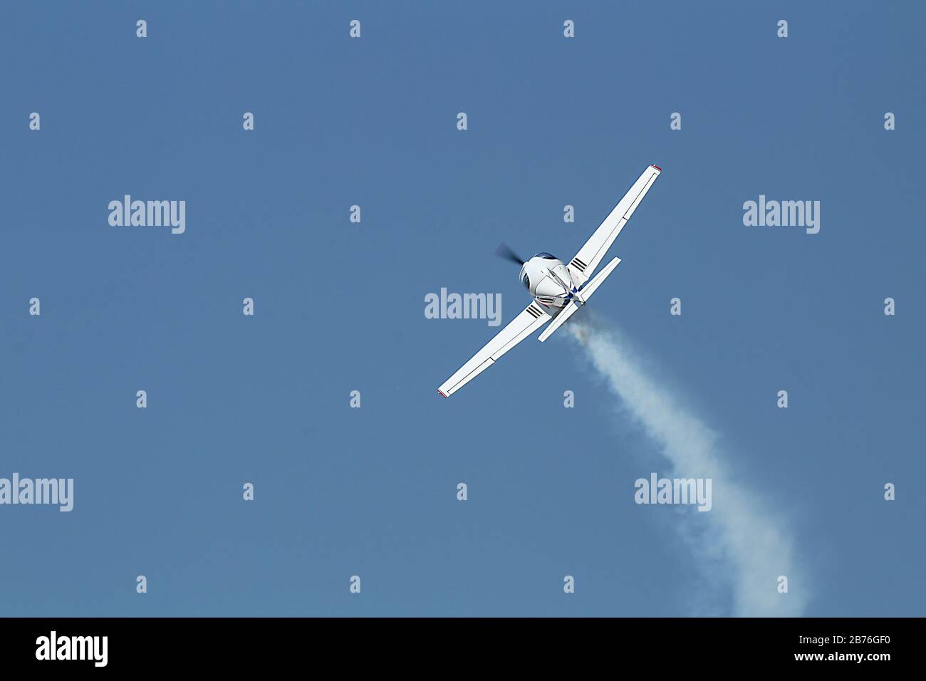 White plane in light flight Stock Photo - Alamy