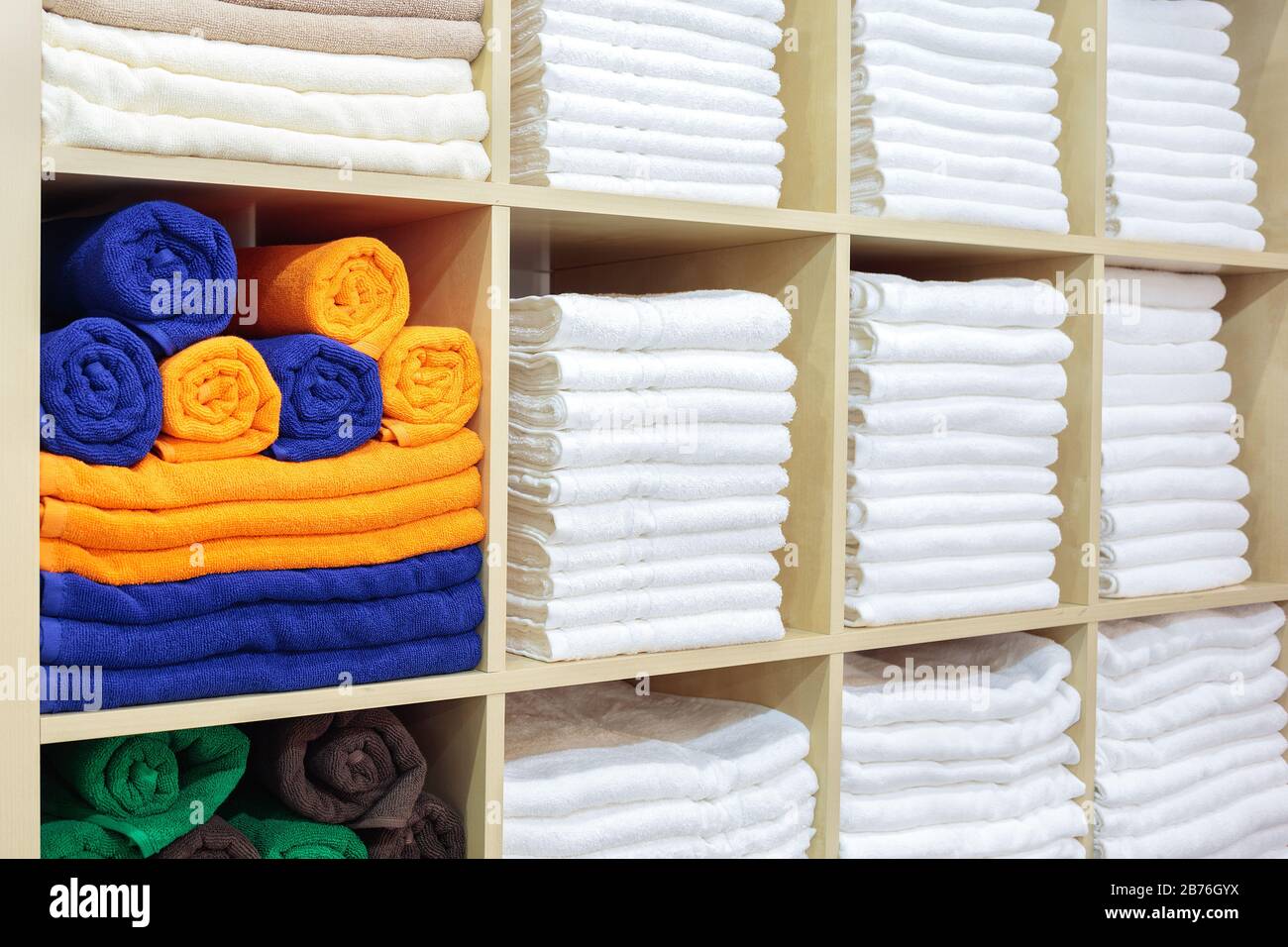 Fresh White Hotel Towels Folded and Stacked on a Shelf Stock Photo - Alamy