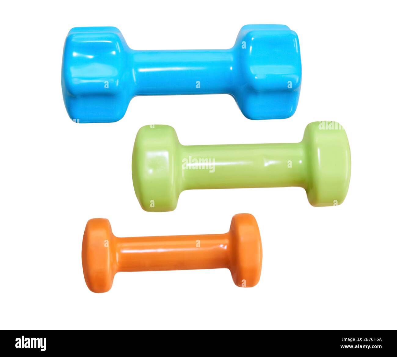 three small rubberized dumbbells of different weights isolated on a ...