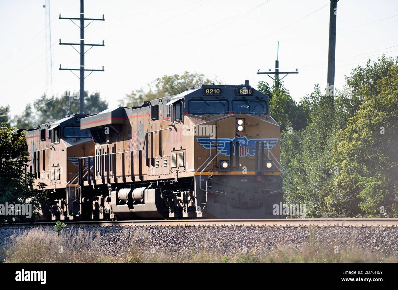 Geneva, Illinois, USA. locomotive units, emerges into a clearing on its ...