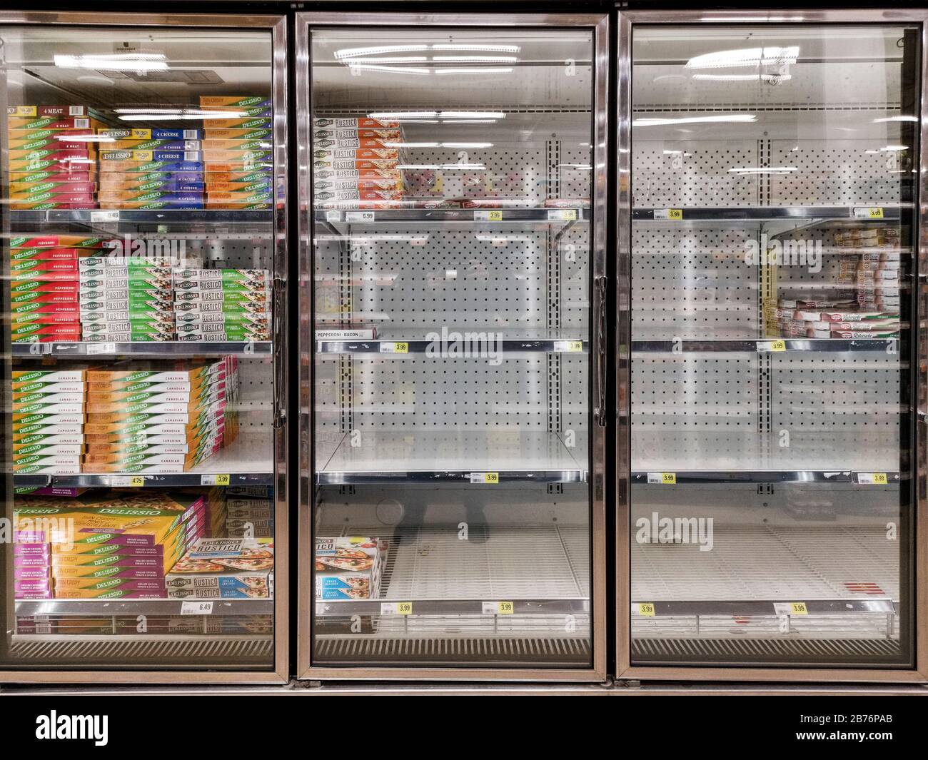 Toronto, Canada. 13th Mar, 2020. Empty refrigerator shelves which once ...