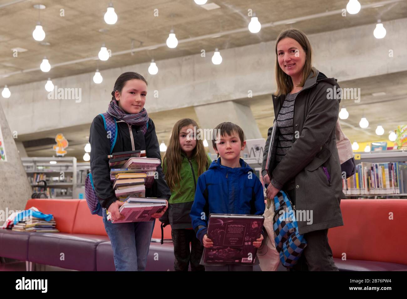 Checking books out library hi-res stock photography and images - Alamy