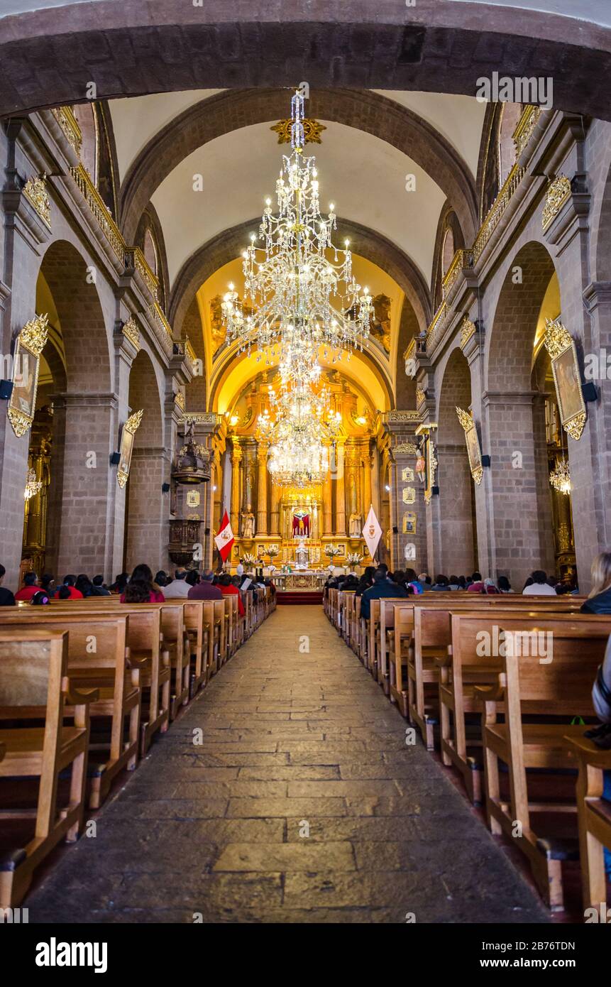 Inside of La Merced Convent with chandeliers, pulpit and altar in Cusco ...
