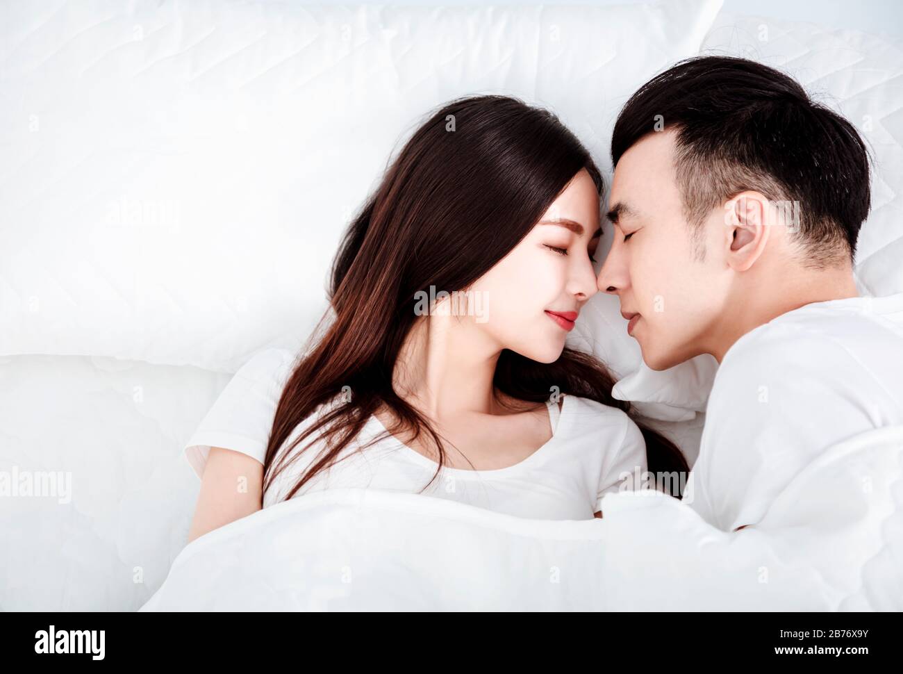 Asian couple bed hi-res stock photography and images - Alamy