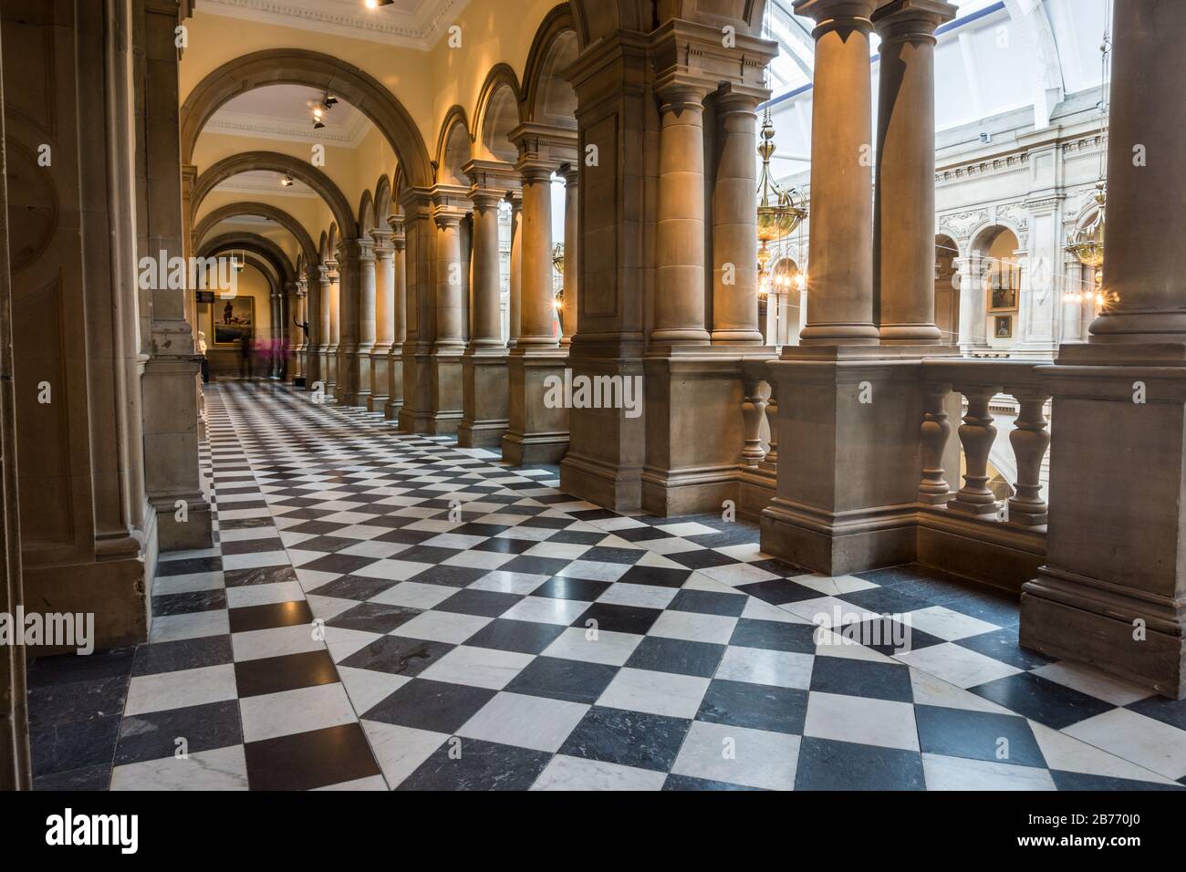 A long ornate corridor with columns and statues, in the Kelvingrove Art ...