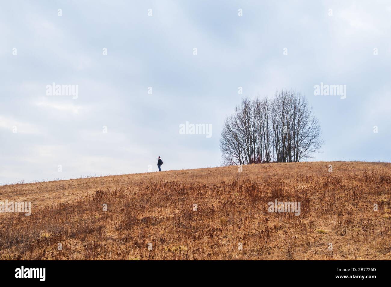 Lonely man on mountain hi-res stock photography and images - Alamy
