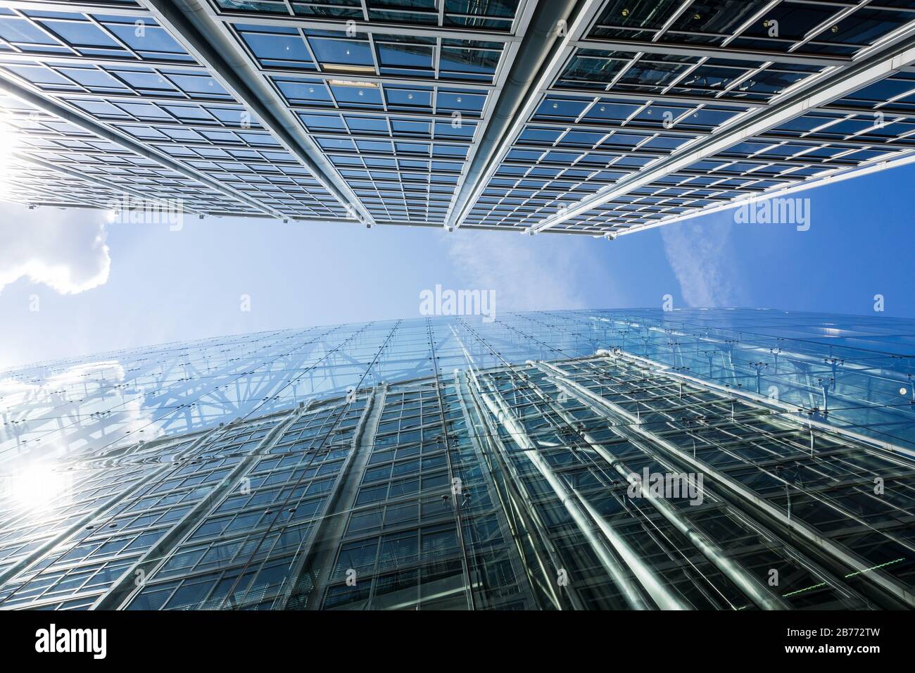 View looking up at modern tall glass buildings in Regent's Place, on ...