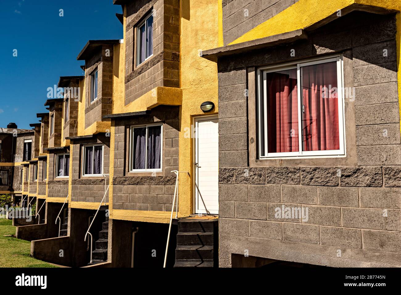 Minimalist construction made in yellow and bricks with the same shape ...