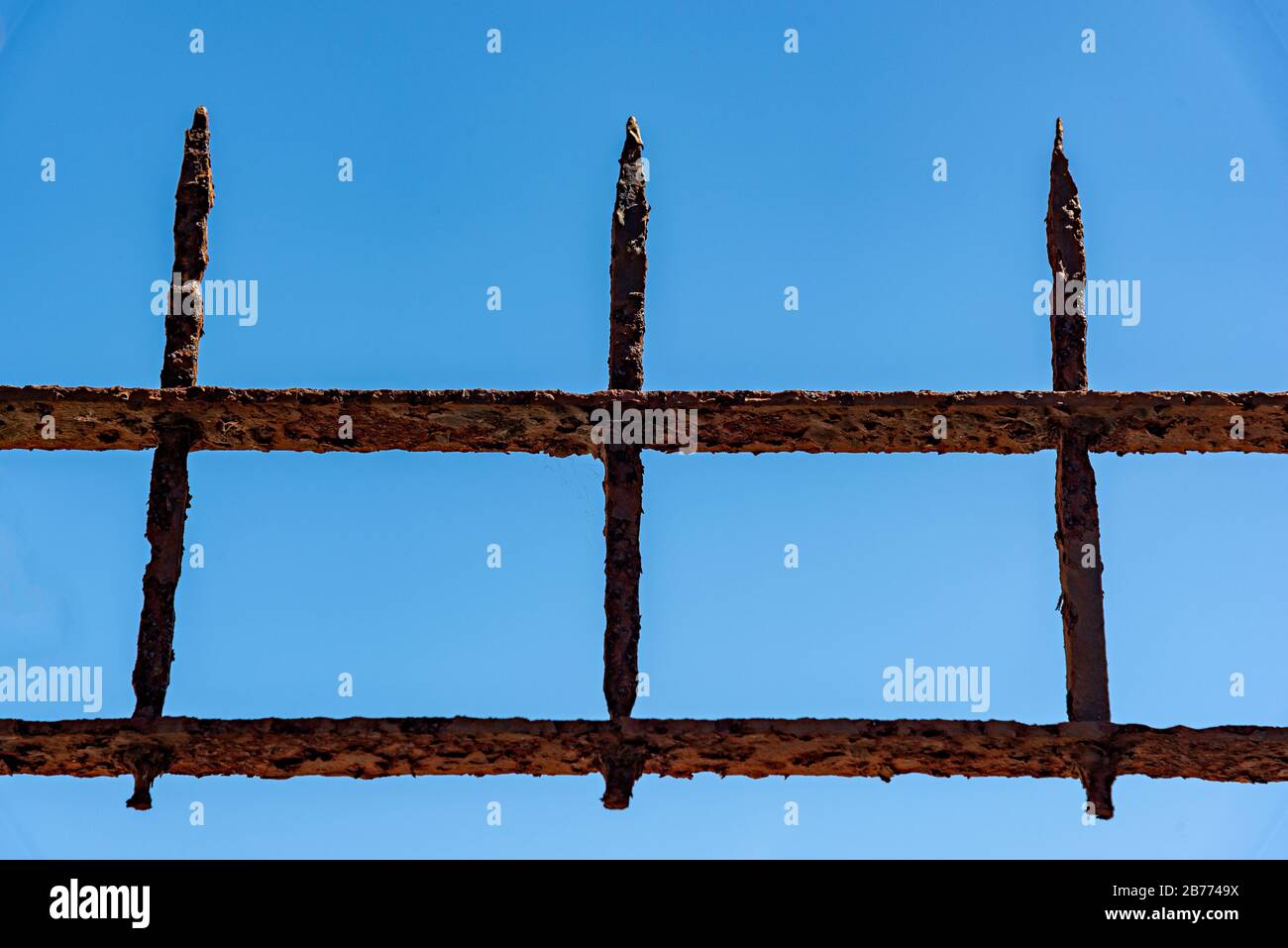 Old rusty grating with a clear blue sky on the background Stock Photo ...
